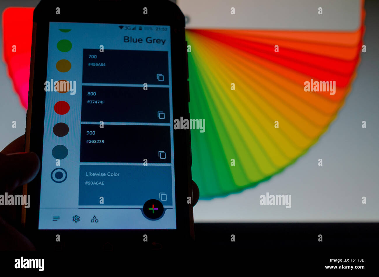 Electronic color palettes between a smartphone and a laptop Stock Photo ...