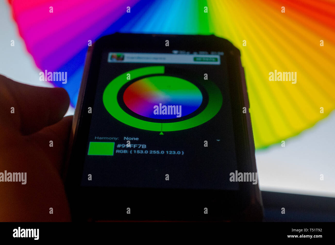 Electronic color palettes between a smartphone and a laptop Stock Photo ...