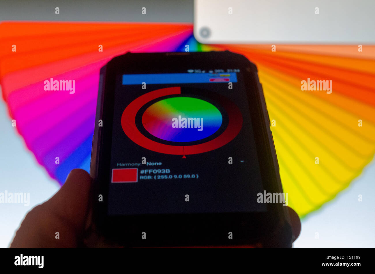 Electronic color palettes between a smartphone and a laptop Stock Photo ...