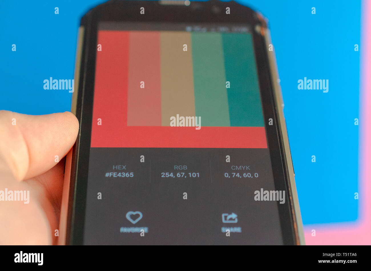 Electronic color palettes between smartphone and blue background Stock ...