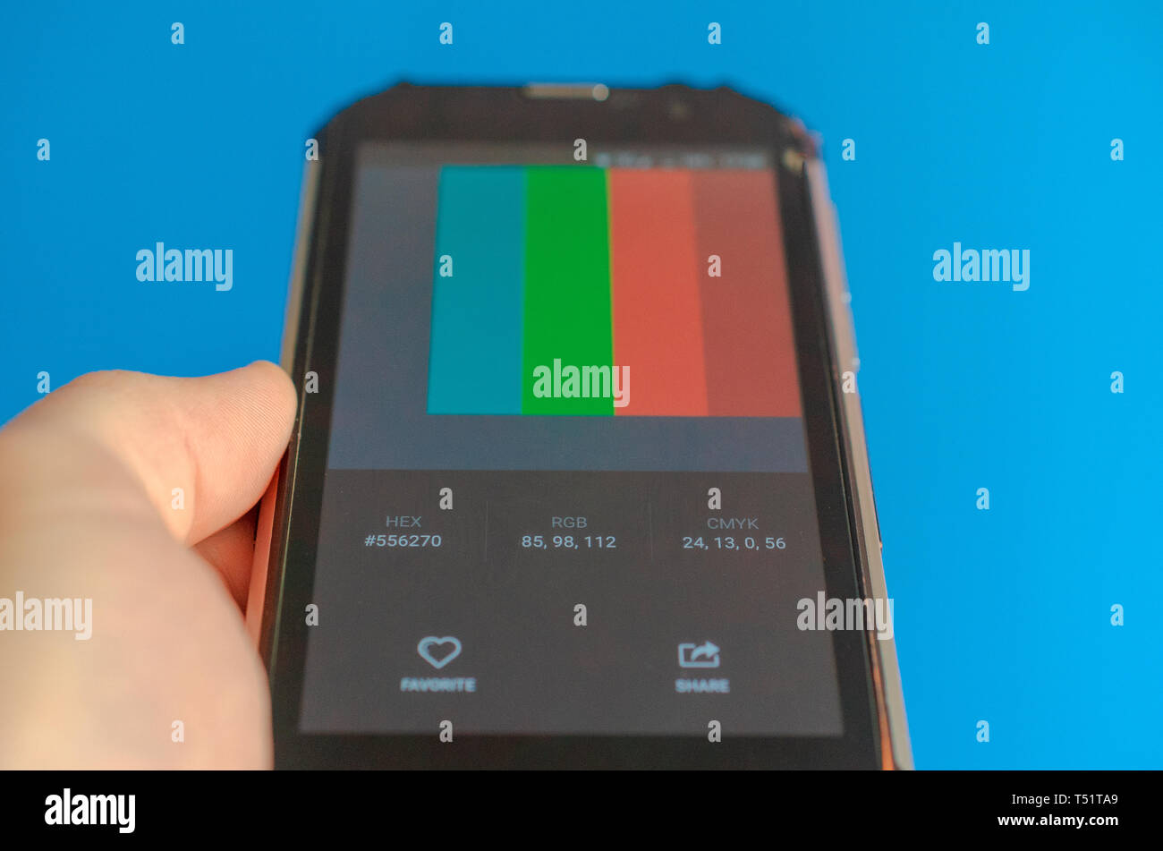 Electronic color palettes between smartphone and blue background Stock ...