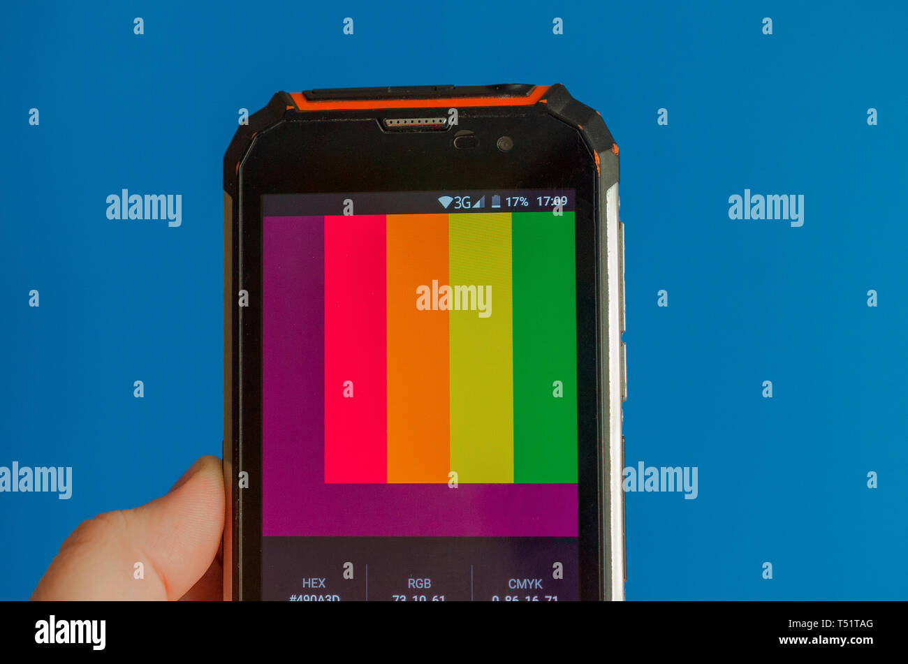 Electronic color palettes between smartphone and blue background Stock ...