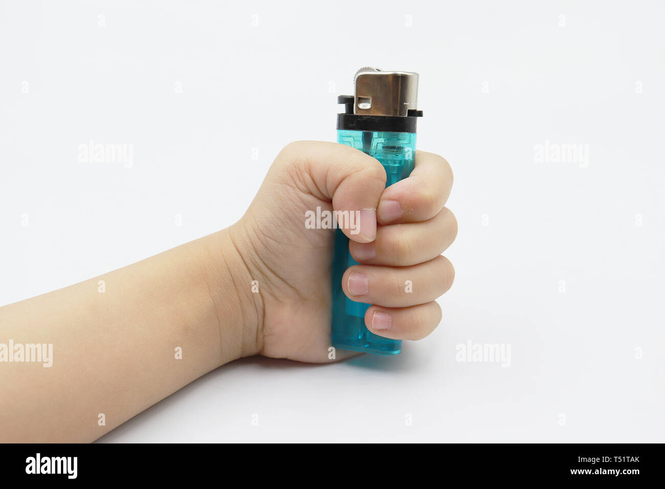 lighter in kid hand on white background Stock Photo - Alamy