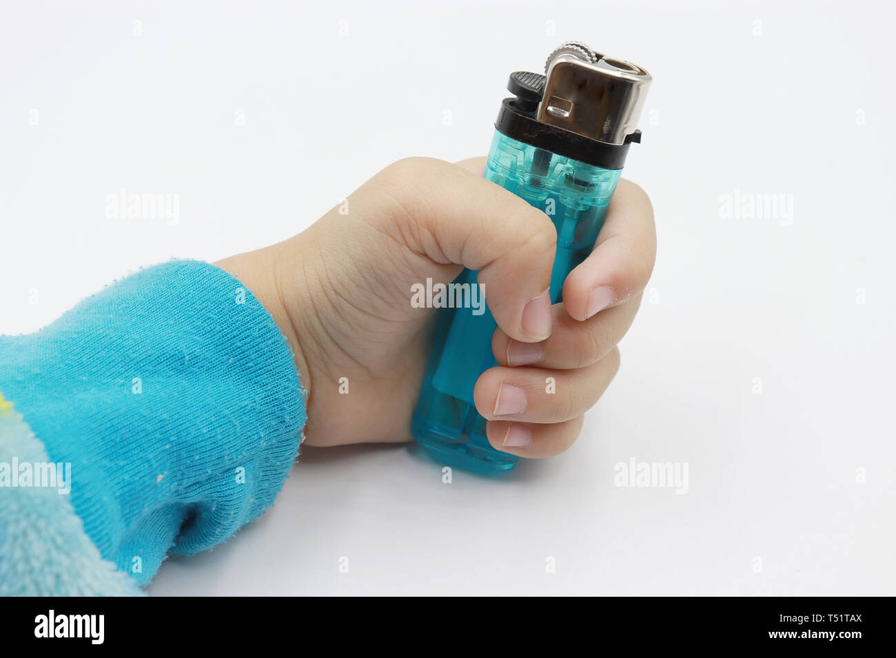 lighter in kid hand on white background Stock Photo - Alamy