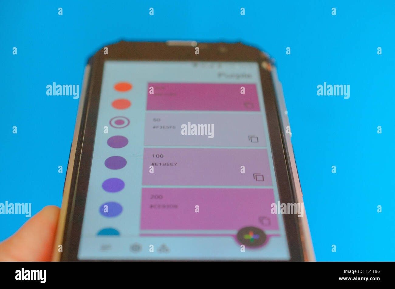 Electronic color palettes between smartphone and blue background Stock ...