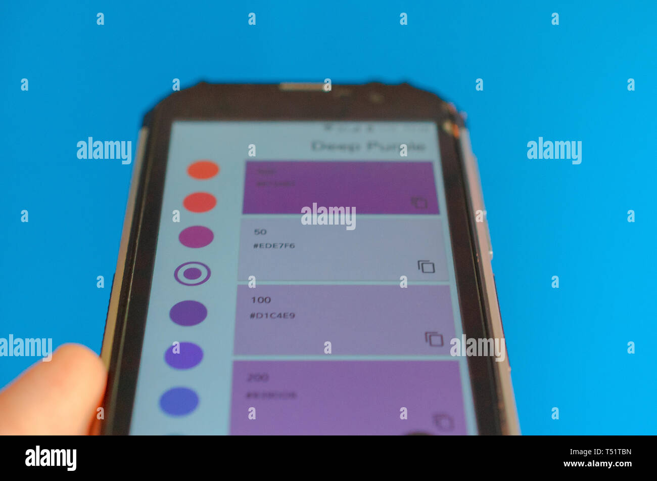 Electronic color palettes between smartphone and blue background Stock ...