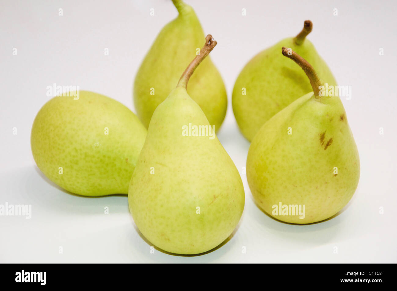 Various pears isolated on white background Stock Photo - Alamy