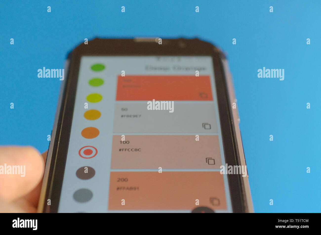Electronic color palettes between smartphone and blue background Stock ...