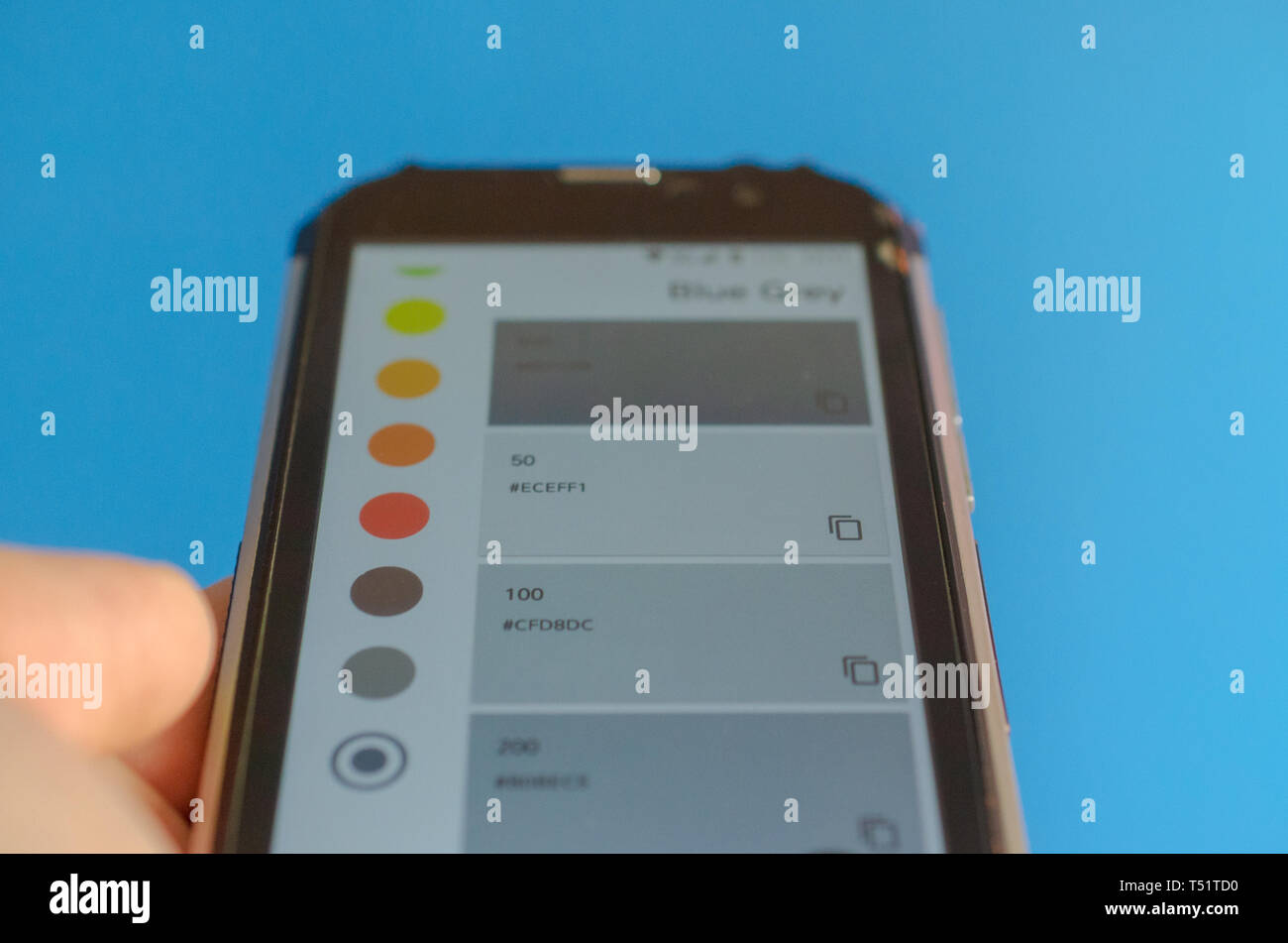 Electronic color palettes between smartphone and blue background Stock ...