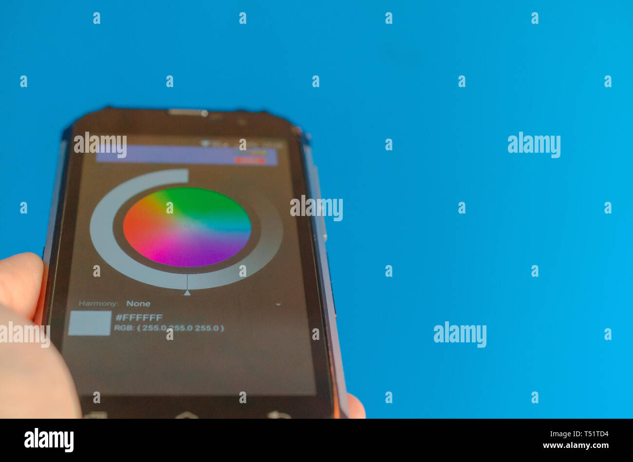 Electronic color palettes between smartphone and blue background Stock ...