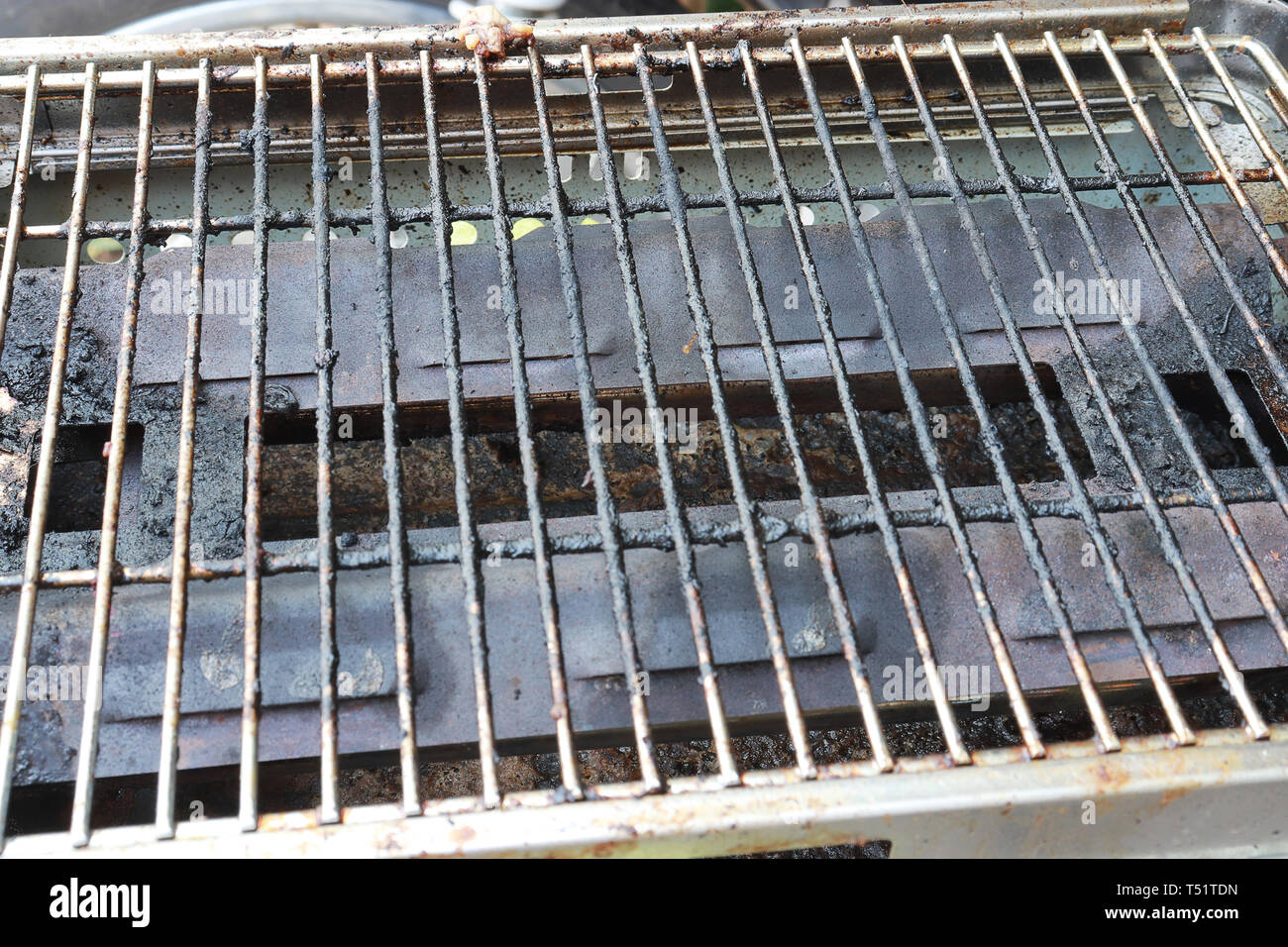 Dirty PORTABLE BARBECUE GRILL Stock Photo - Alamy