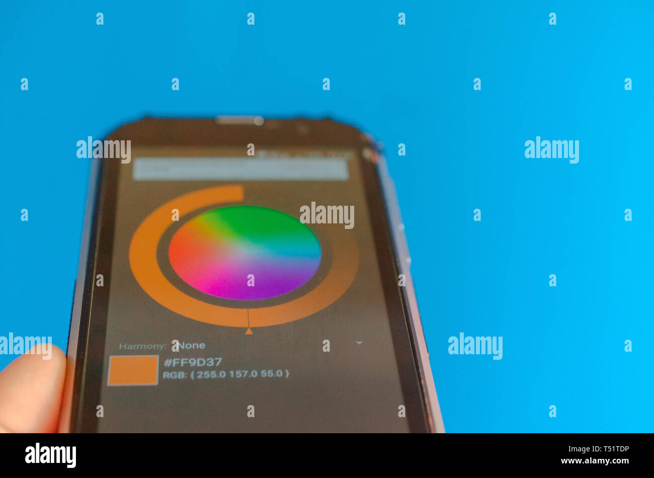 Electronic color palettes between smartphone and blue background Stock ...