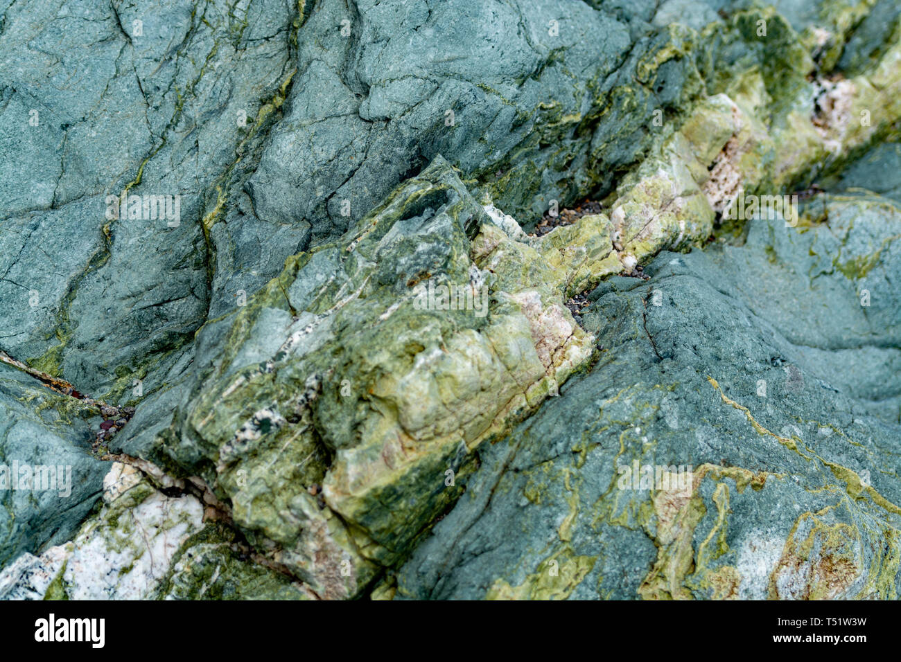 Background with green mineral rock close up, gemstone texture, olivine ...