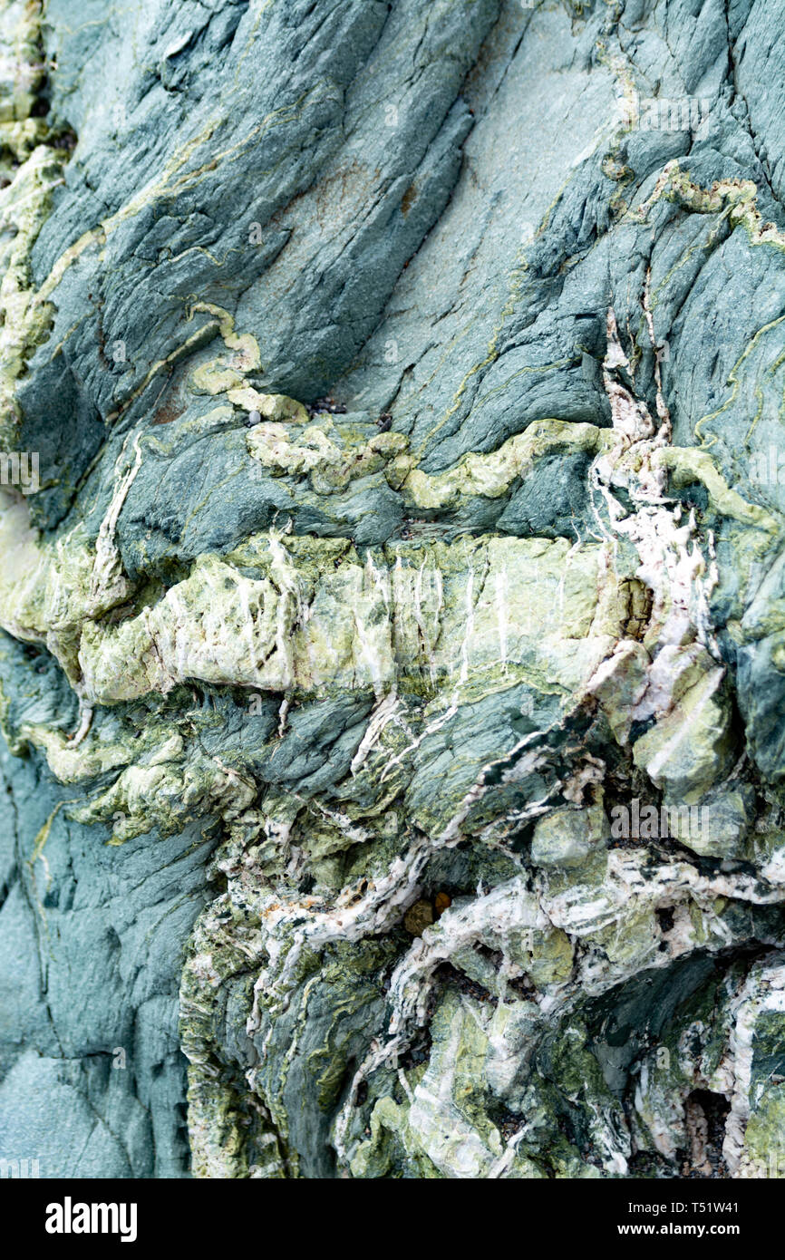 Background with green mineral rock close up, gemstone texture, olivine ...