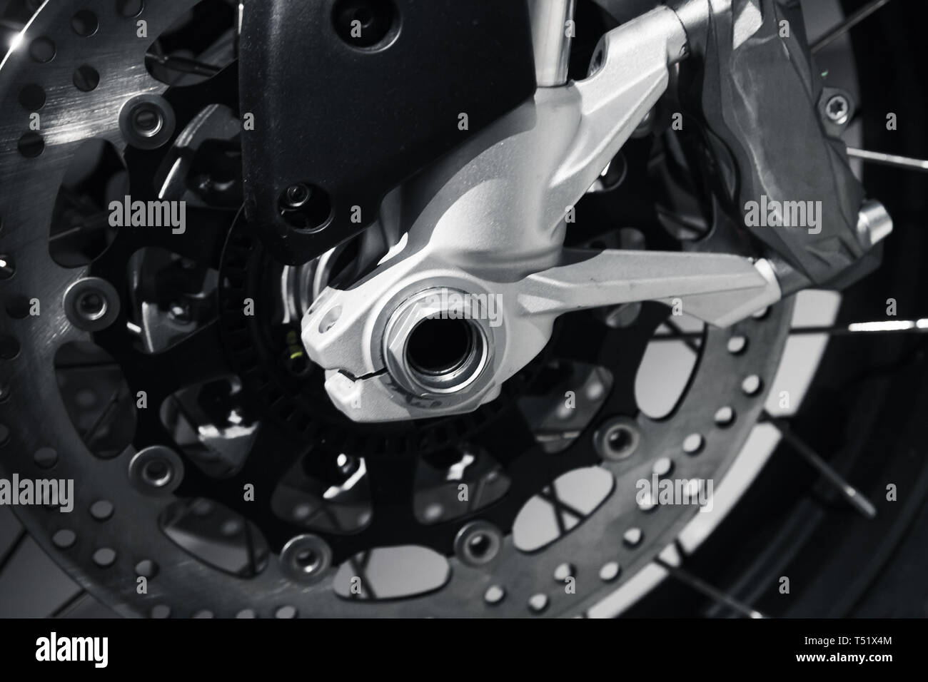 Front motorcycle wheel fragment with brake disc. Close-up black and ...