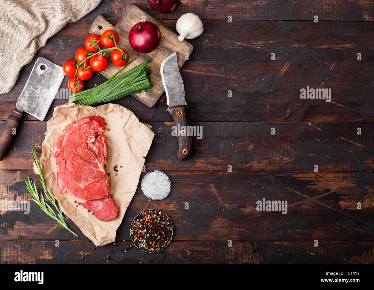 Fresh raw organic slice of braising steak fillet on butchers paper with ...