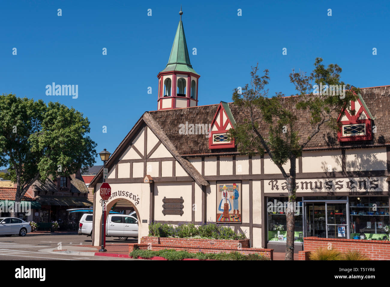 Craft store with steeple onto of roof and street corner Stock Photo - Alamy