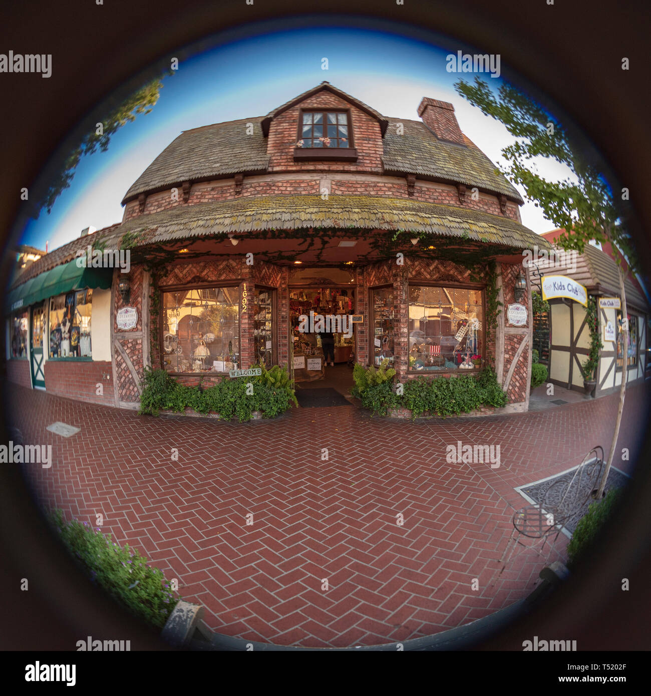 Wide angle view of gift shop showing sidewalk, store front and roof ...