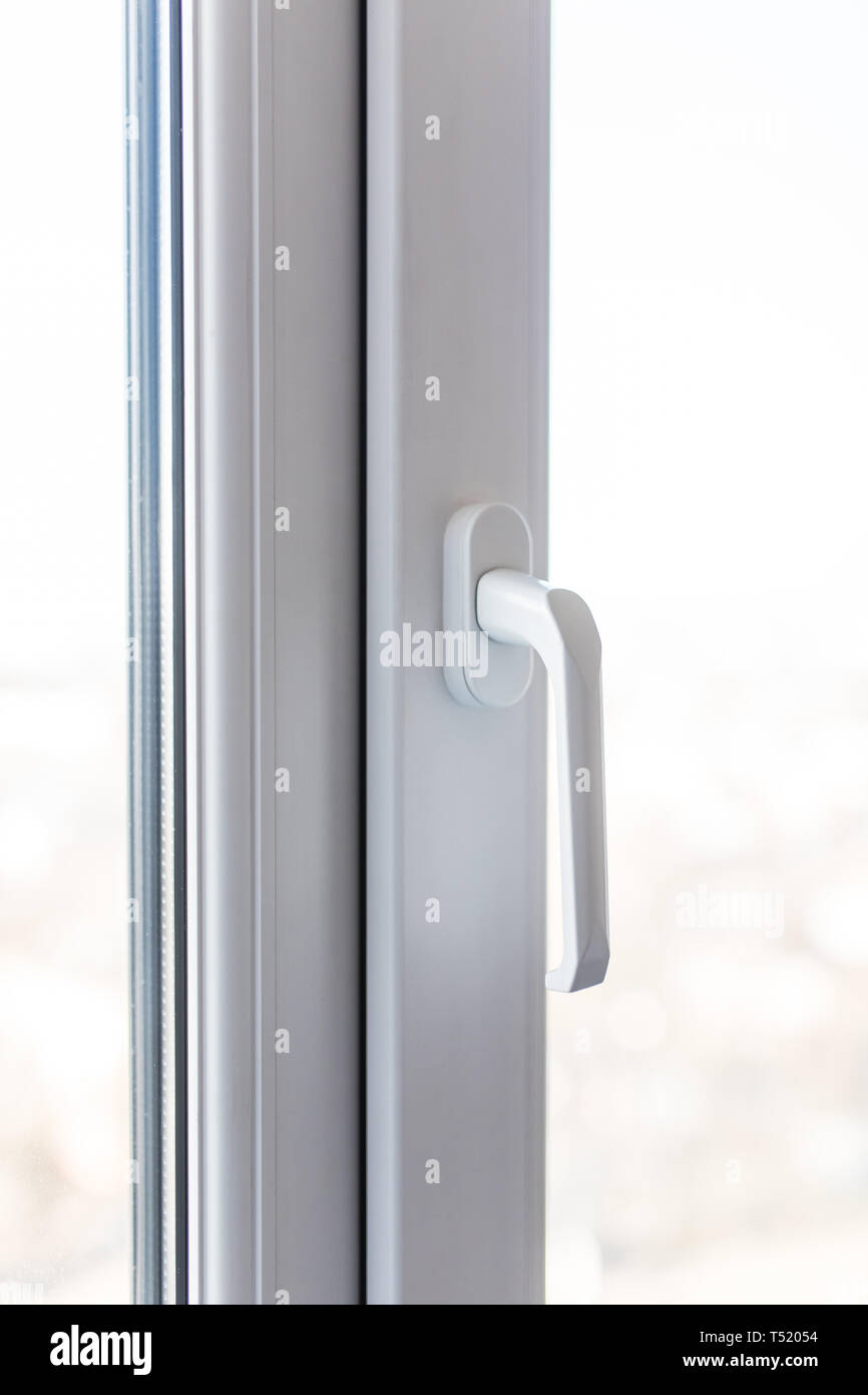 With window handle to the window open and window closed Stock Photo - Alamy