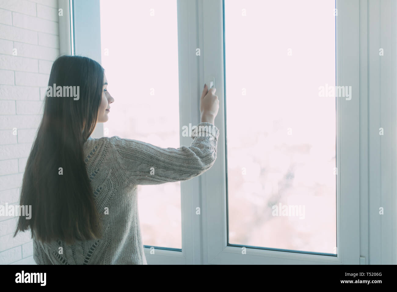 Woman opening new modern window, closeup view Stock Photo - Alamy
