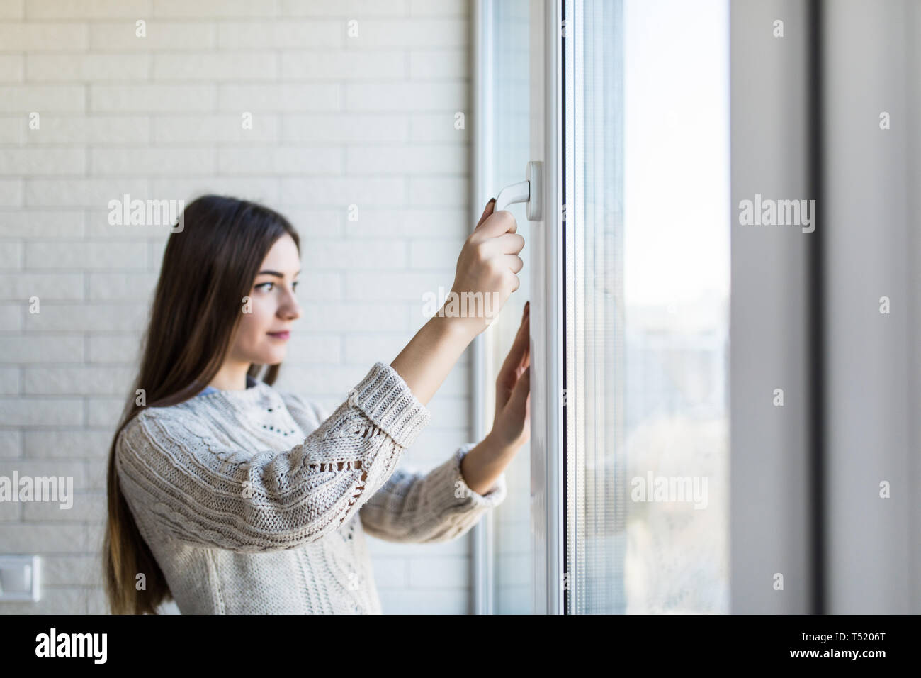Woman opening new modern window, closeup view Stock Photo - Alamy