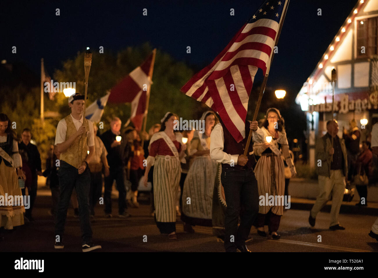People in candle light parade caring American flag Stock Photo - Alamy
