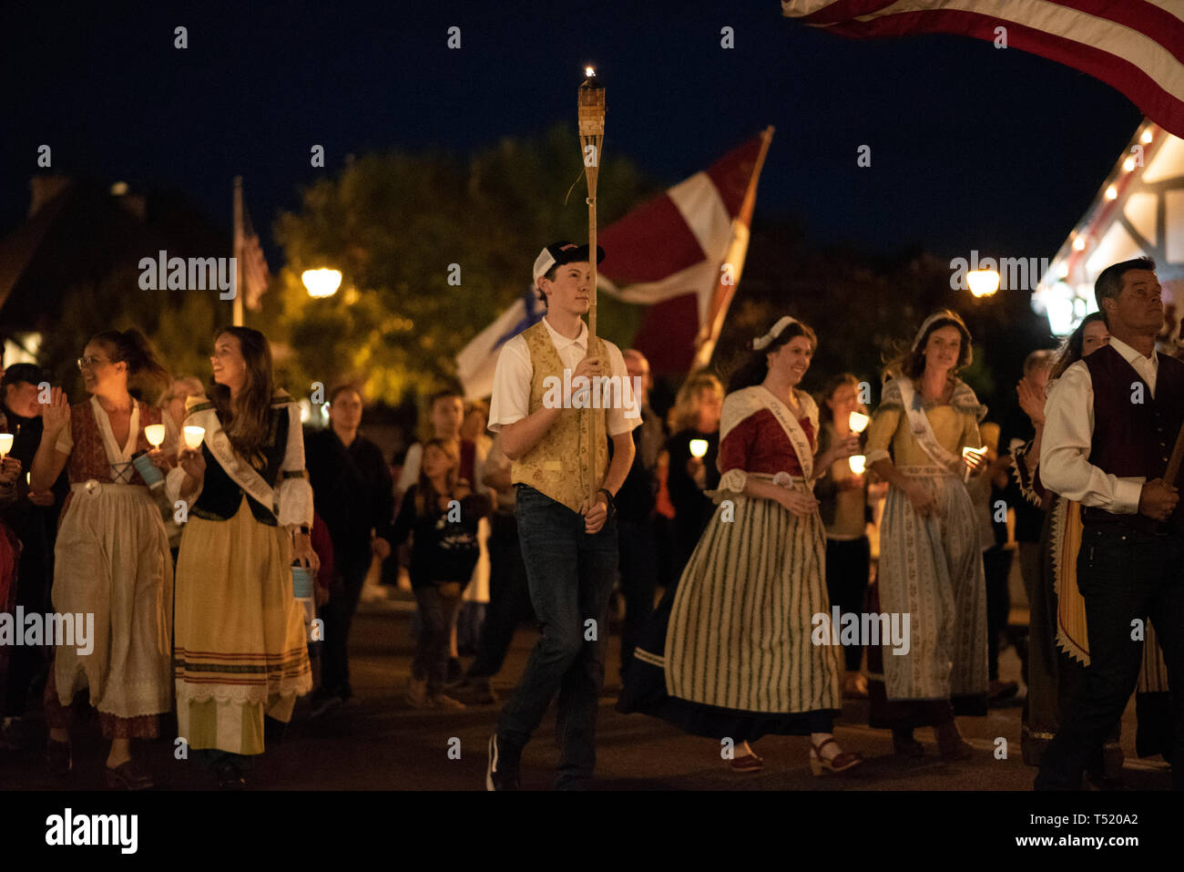 Parade at night with people holding candles Stock Photo - Alamy