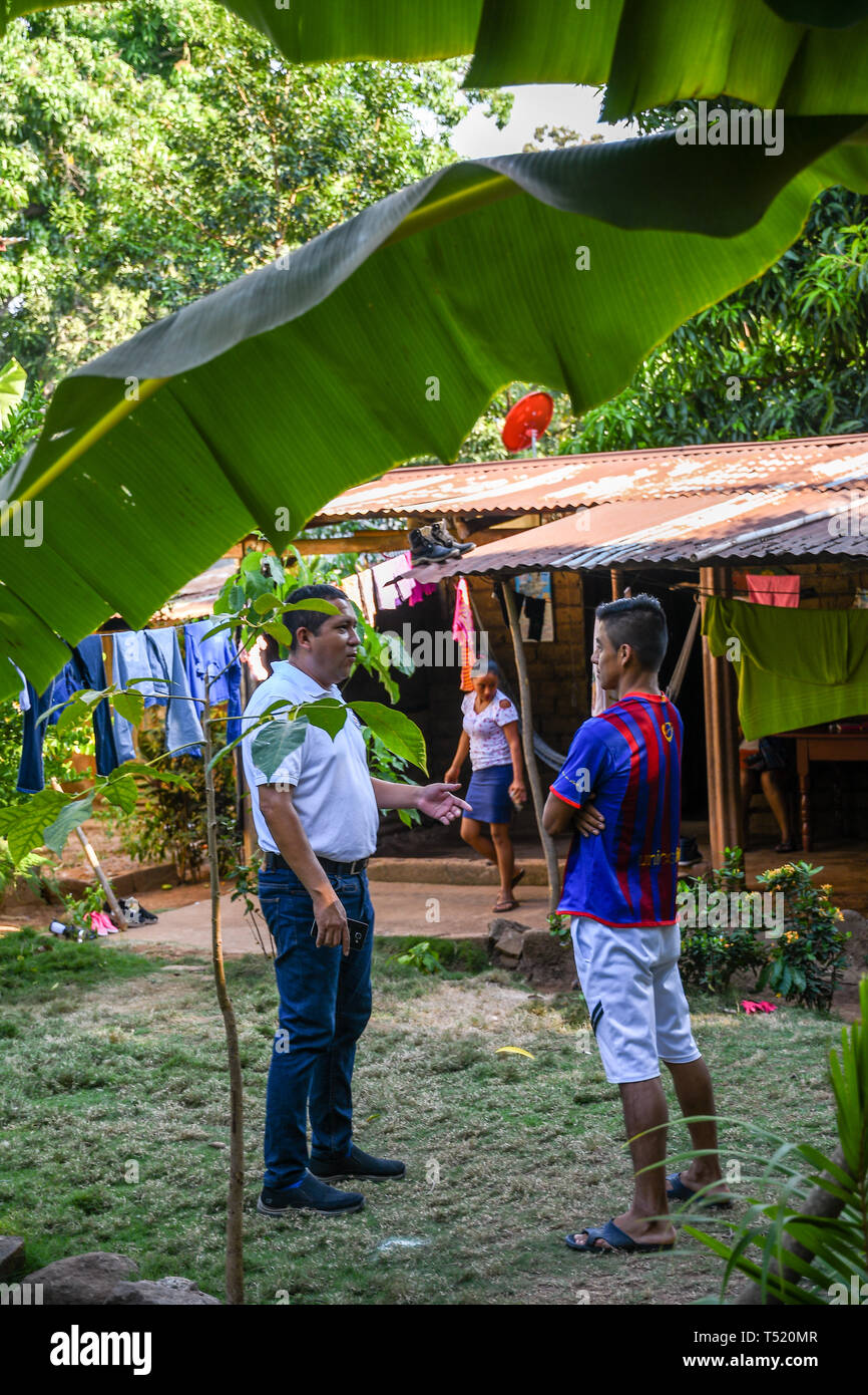 latin people speaking outside house in Guatemala Stock Photo - Alamy