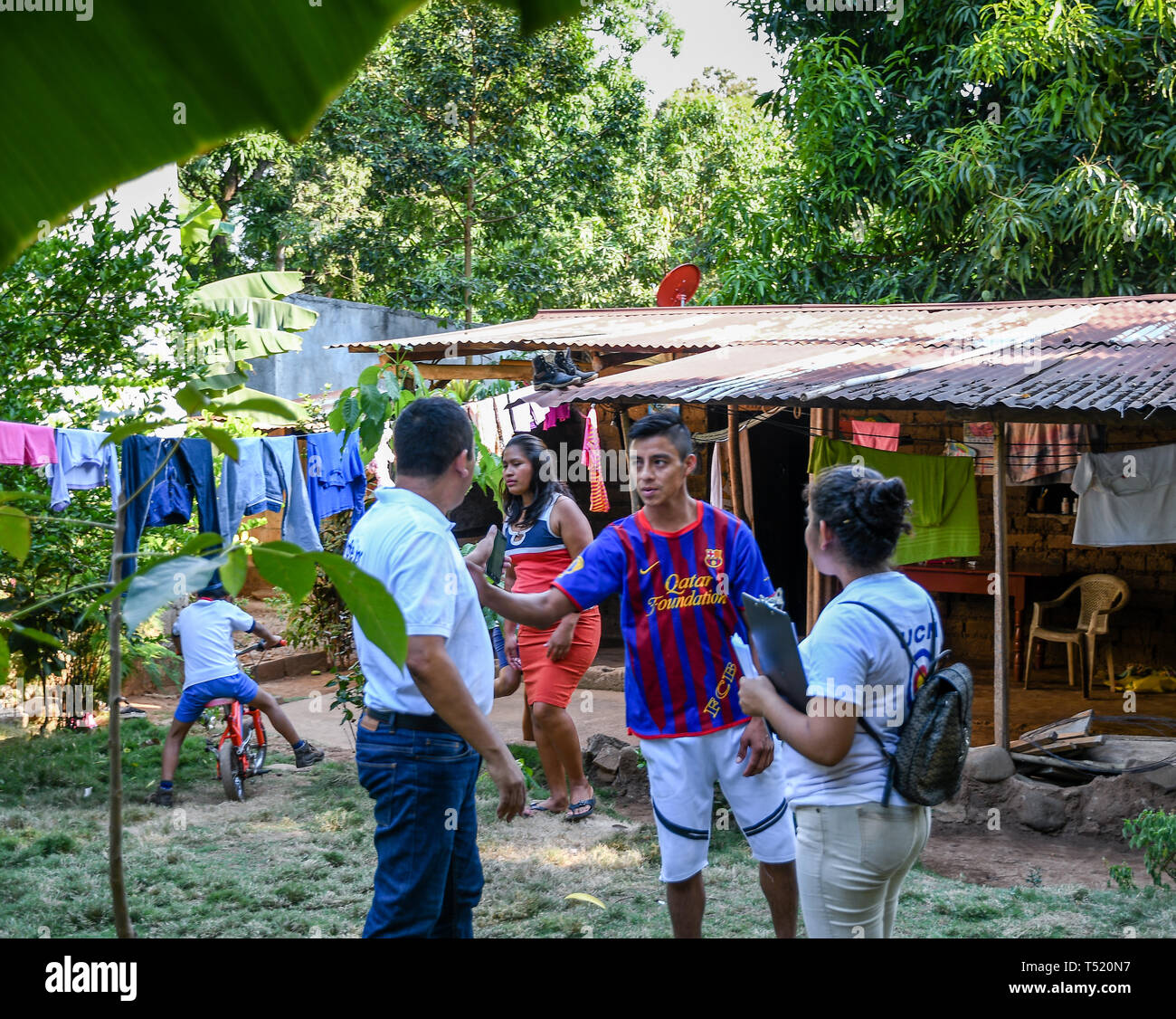 latin people speaking outside house in Guatemala Stock Photo - Alamy