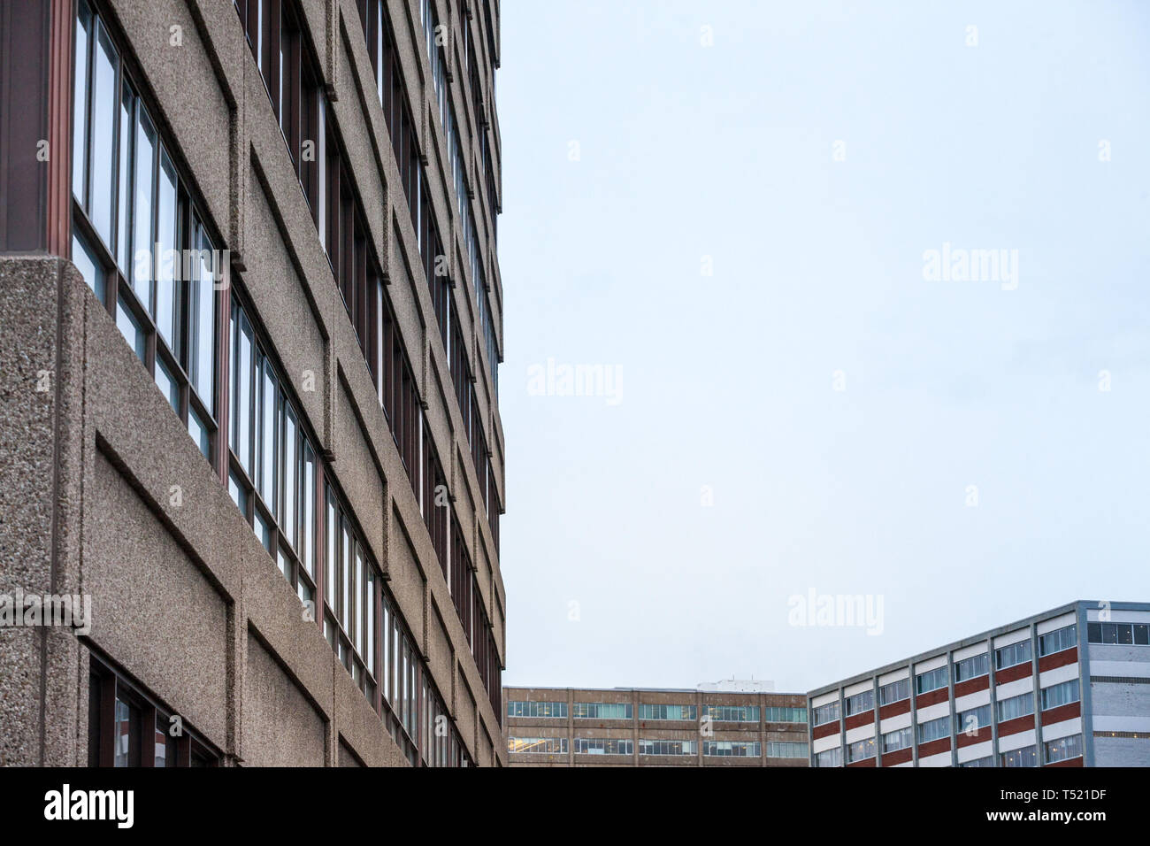 Facade of old concrete industrial warehouses, office and factory ...
