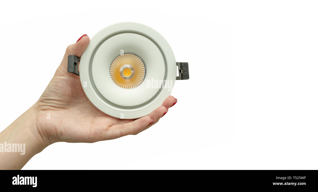 Close up woman hand holding modern Led lamp. Isolated on a white ...