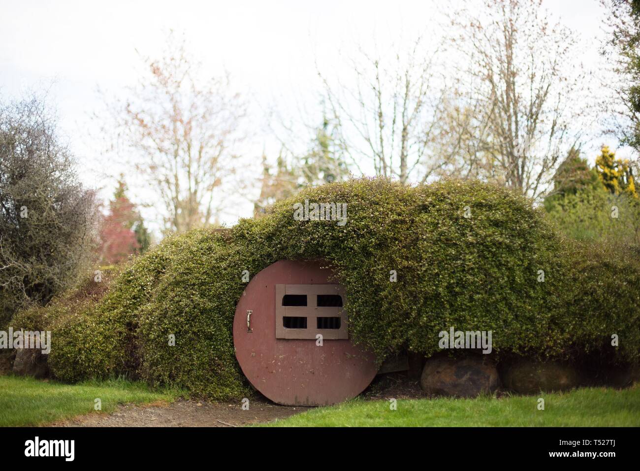 A tiny "hobbit house" with round door at the Oregon Garden in Silverton ...