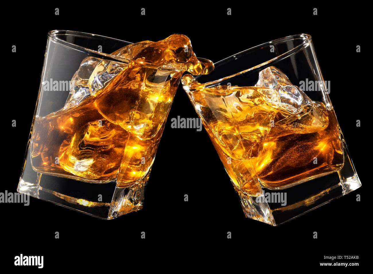 glasses of whiskey making toast Stock Photo - Alamy