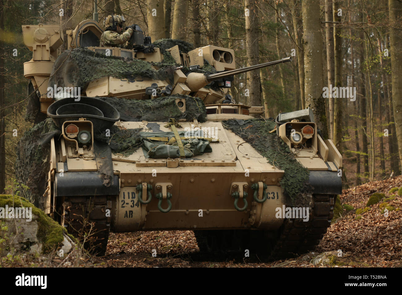 A U.S. Soldier of 2nd Battalion, 34th Armored Regiment, scans their ...