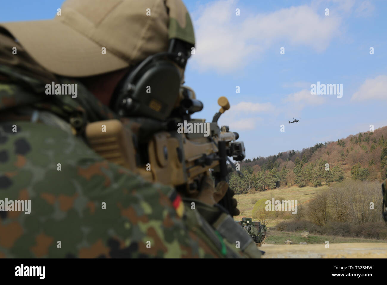 A German soldier scans his sector of fire during exercise Allied Spirit ...
