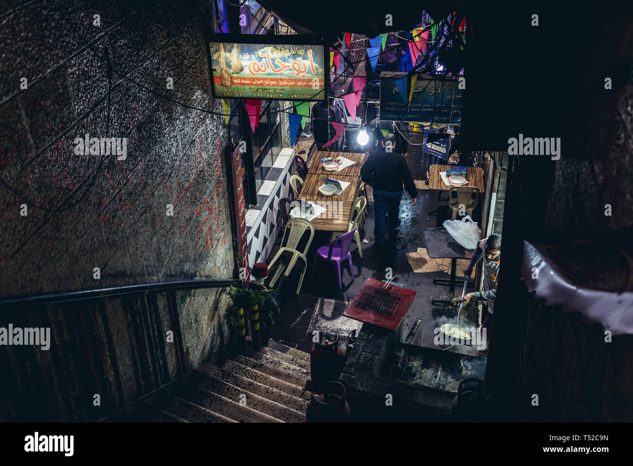 Narrow alley with shops and small restaurants in Amman city, Jordan ...