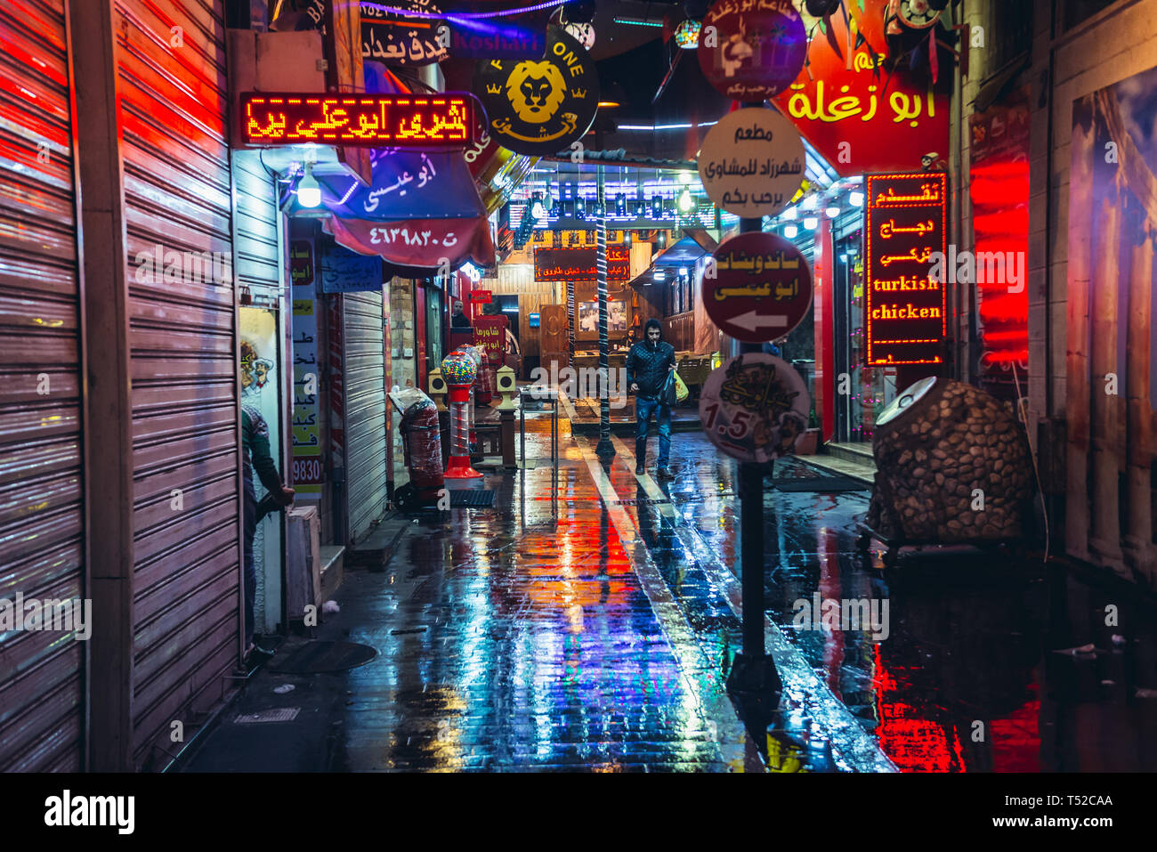 Narrow alley with shops and small restaurants in Amman city, Jordan ...