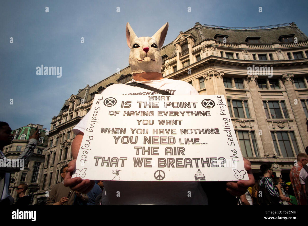 An Environmental activist dressed as a white rabbit from Extinction ...