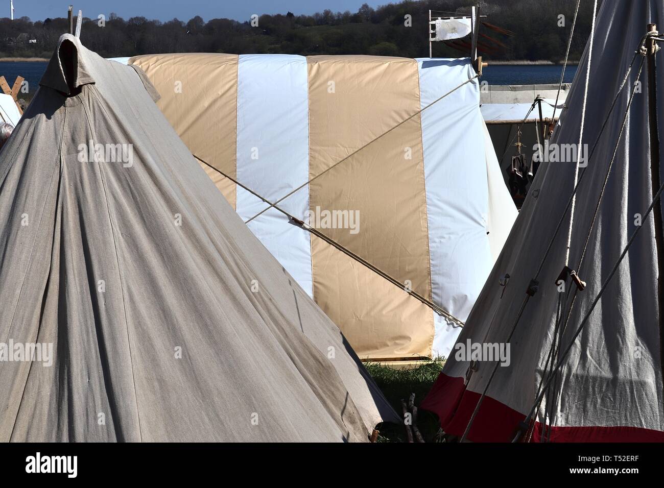 Old vikings tent made of cloth and wood in front of a blue sky Stock ...