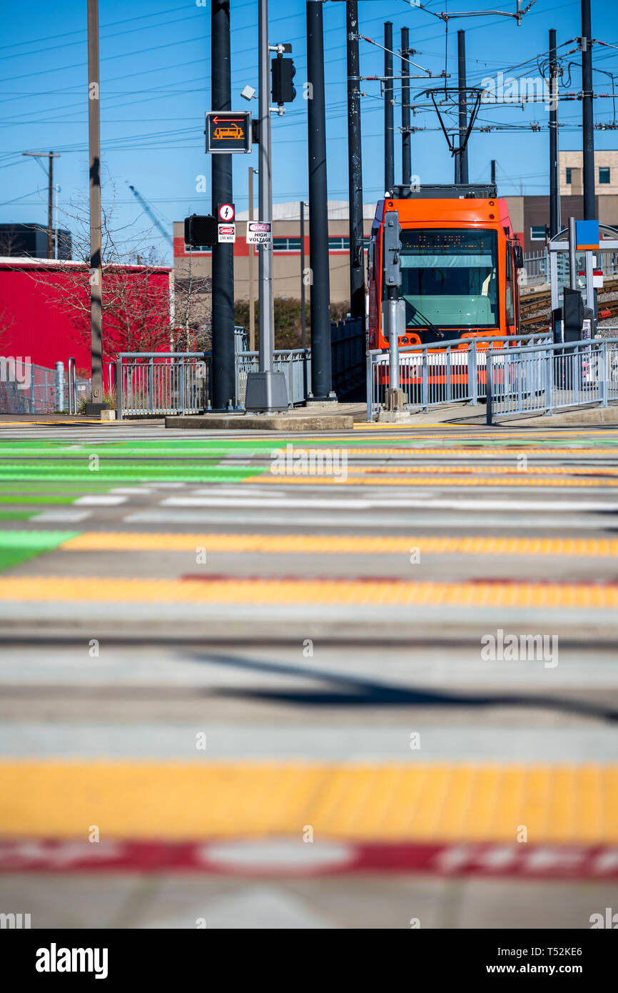 Portland Oregon local transportation streetcar carrying passengers as ...