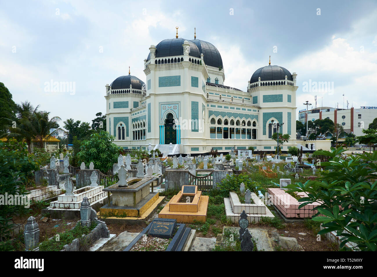 Exterior of the Great Mosque, with Muslim cemetery, in central Medan ...