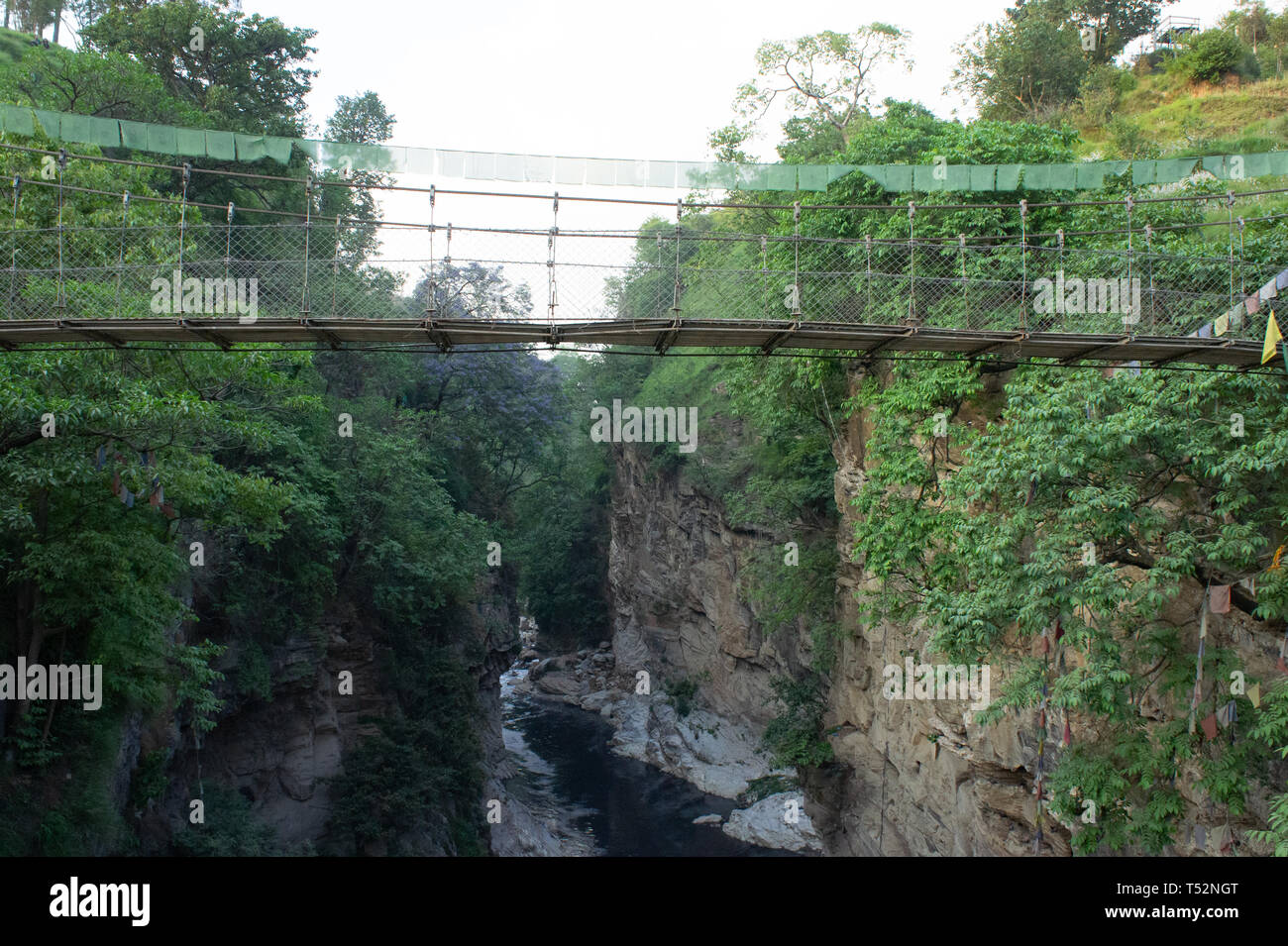 A suspension bridge on the chovar gorge in the Kathmandu Valley, Nepal ...