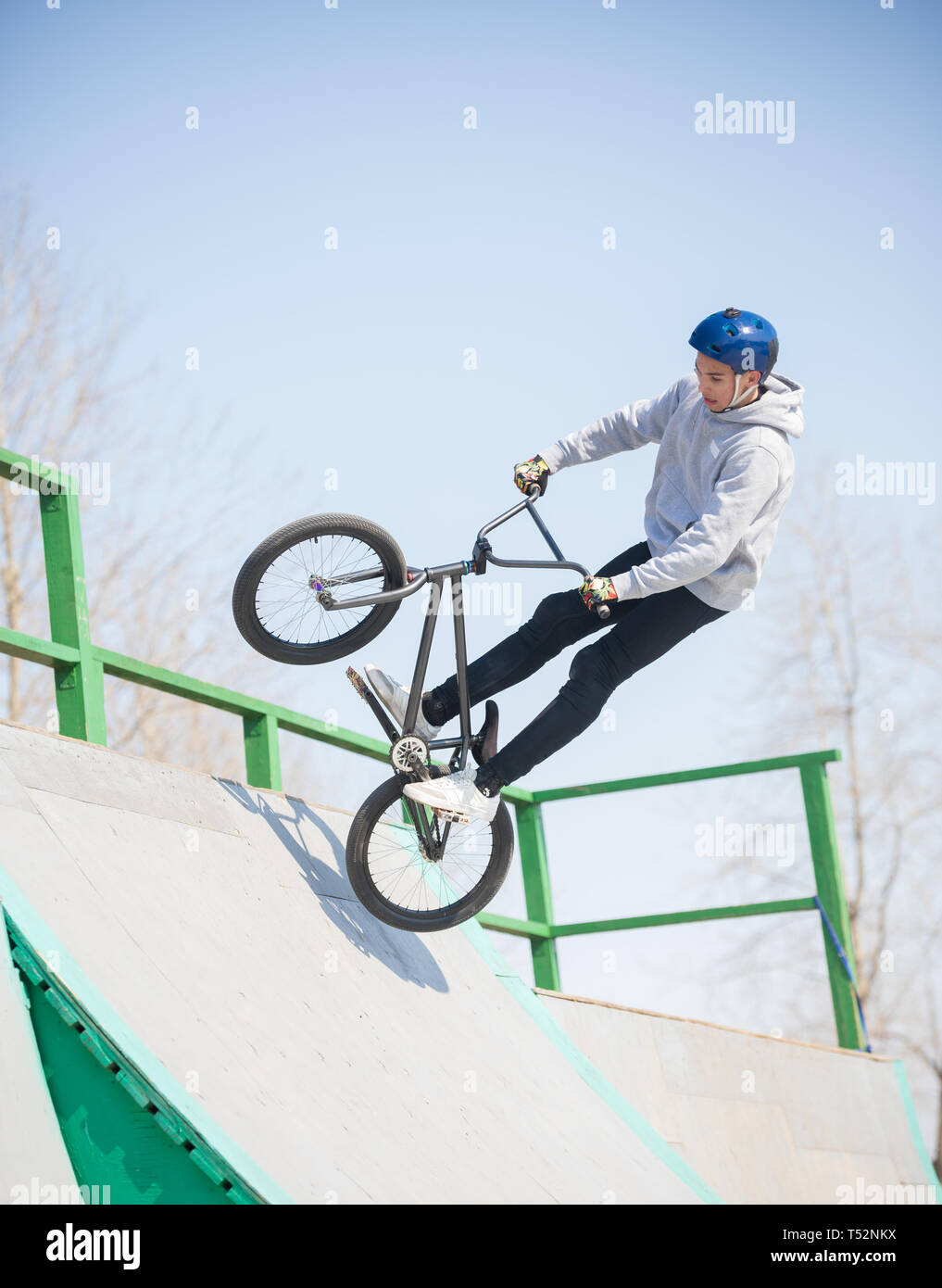 A man performs tricks on a bicycle on the half pipes Stock Photo - Alamy