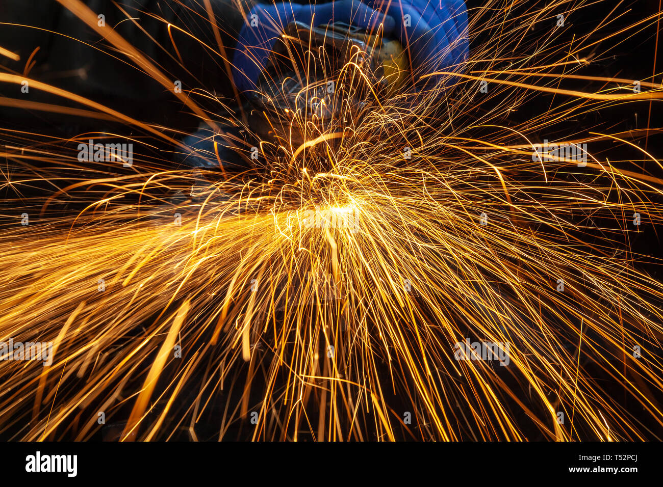 Bright lighting from spark welding Iron soldering, Man working on iron ...