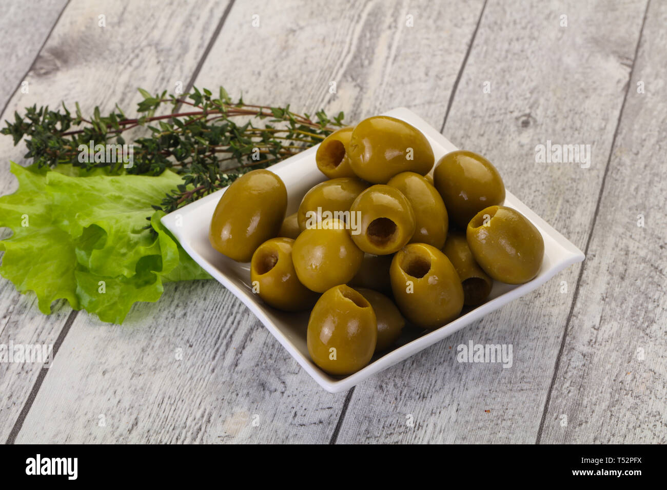 Big green olives in the bowl Stock Photo - Alamy