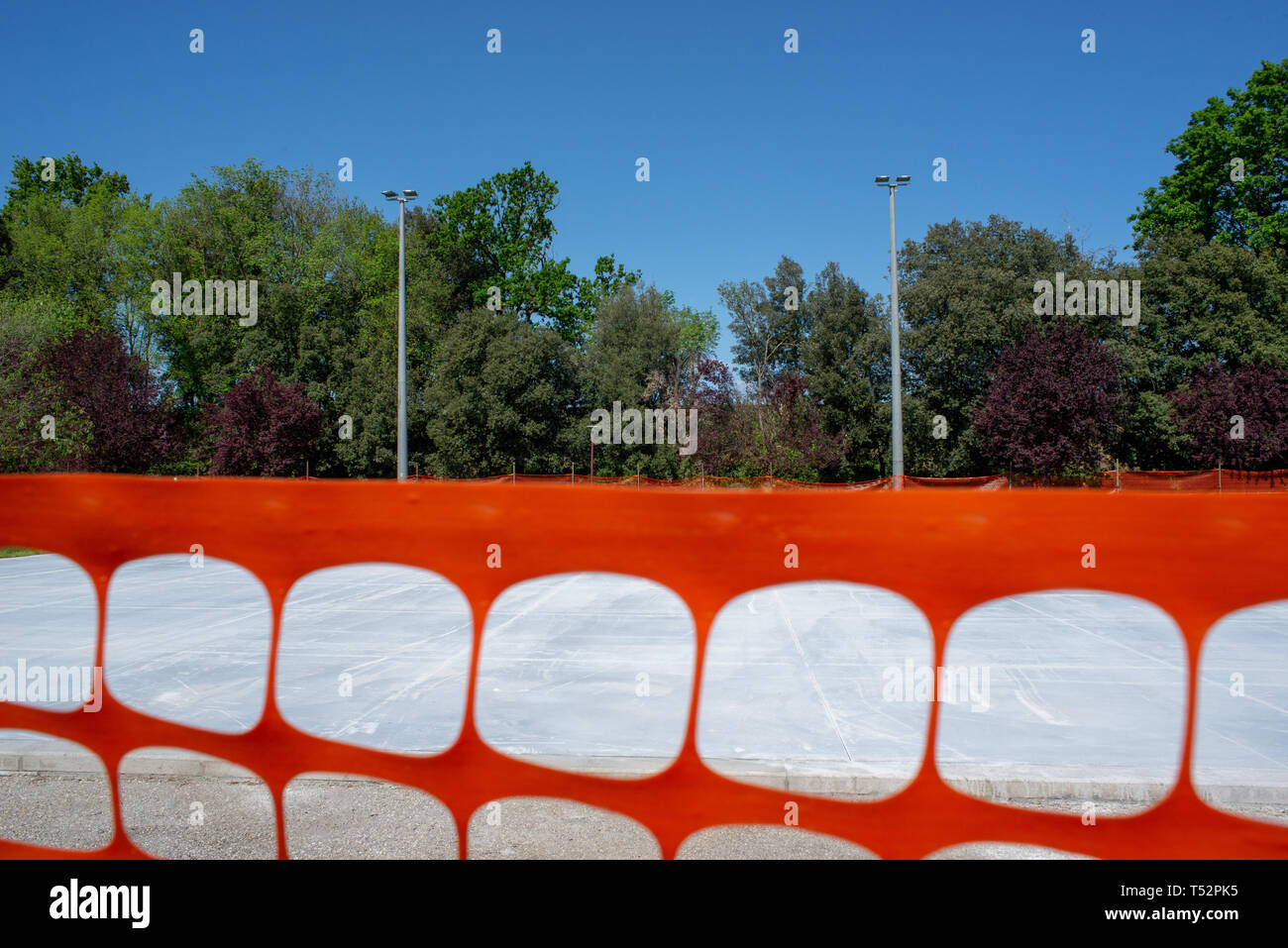 Orange plastic safety netting barrier used at a construction site Stock ...