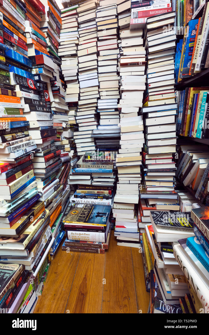stacks of books in a room Stock Photo - Alamy