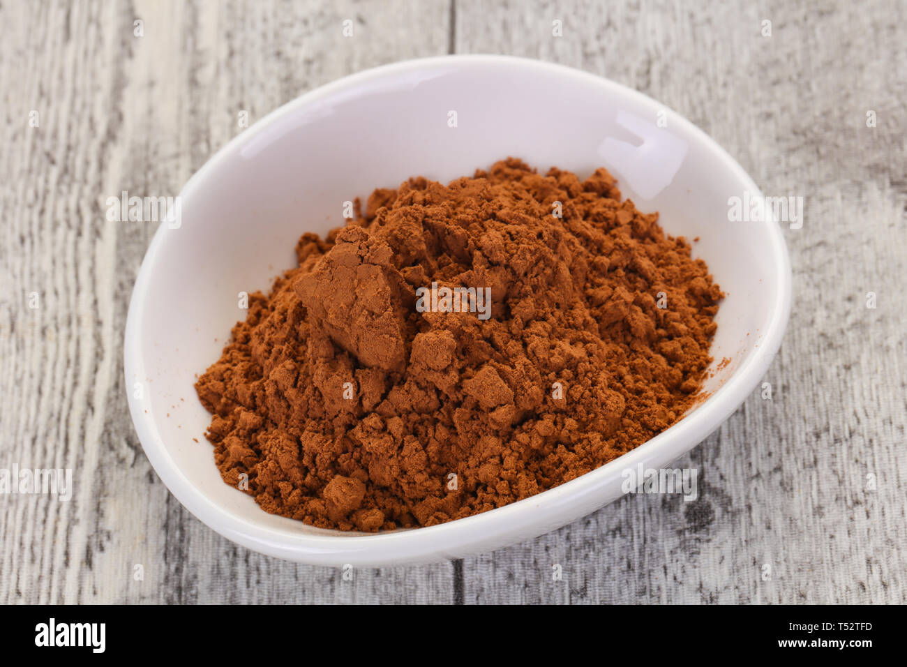 Cocoa powder in the bowl - ready for cooking Stock Photo - Alamy