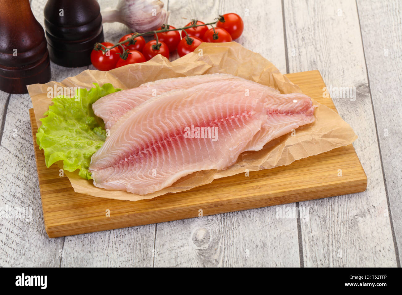 Raw tilapia fish ready for cooking Stock Photo - Alamy