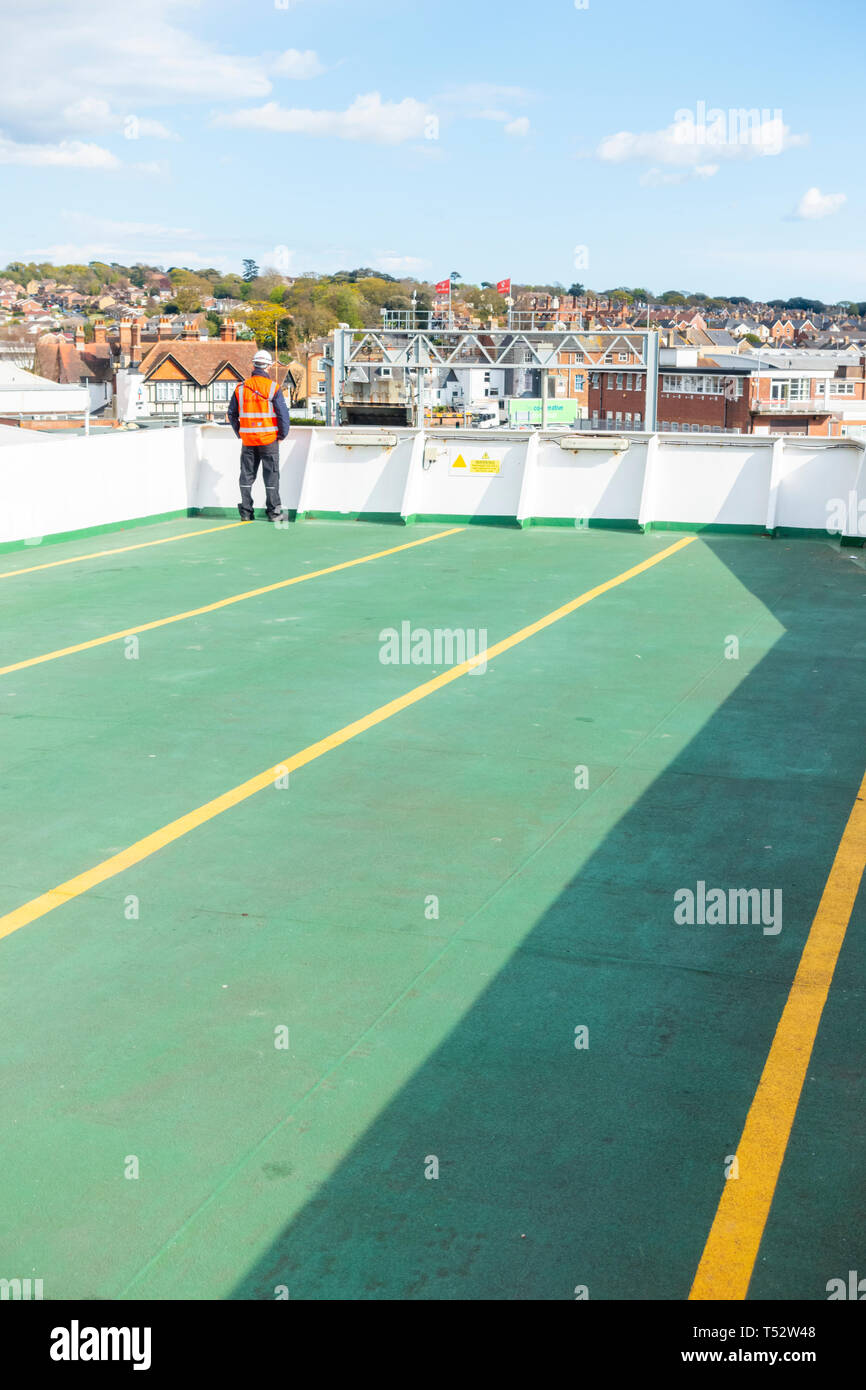 Crew man aboard a Red Funnel Ferry as it docks at East Cowes, Isle of ...
